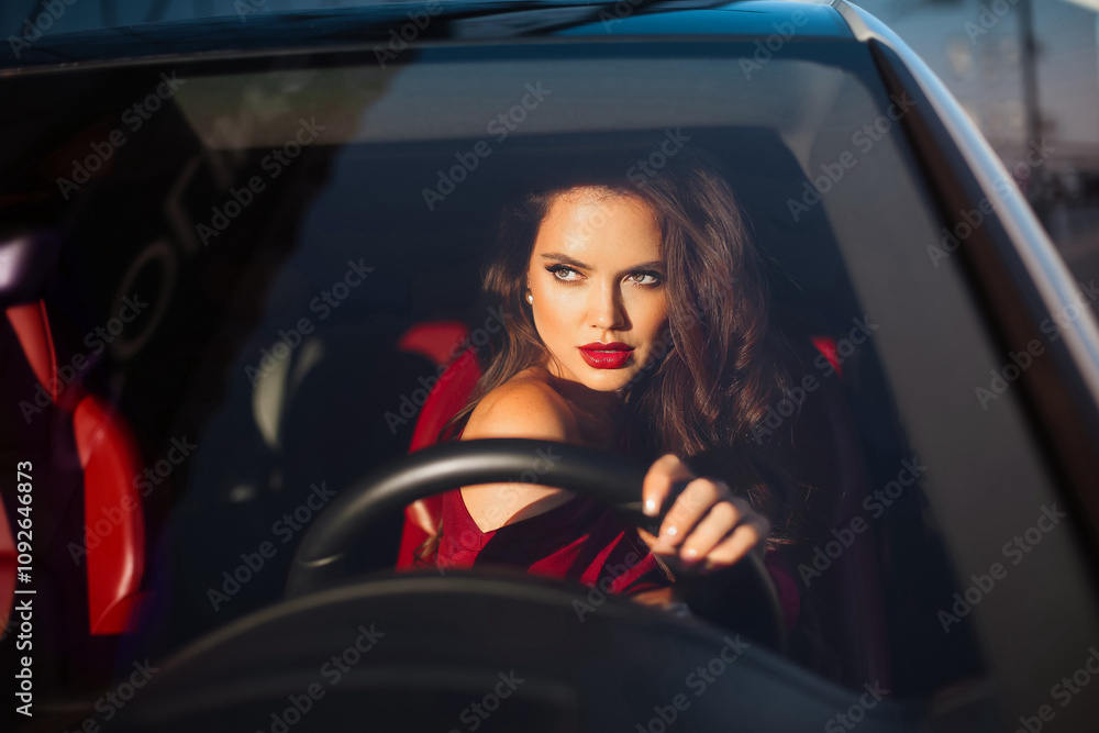 Beautiful Smiling woman driving car in red, attractive girl sitting in ...