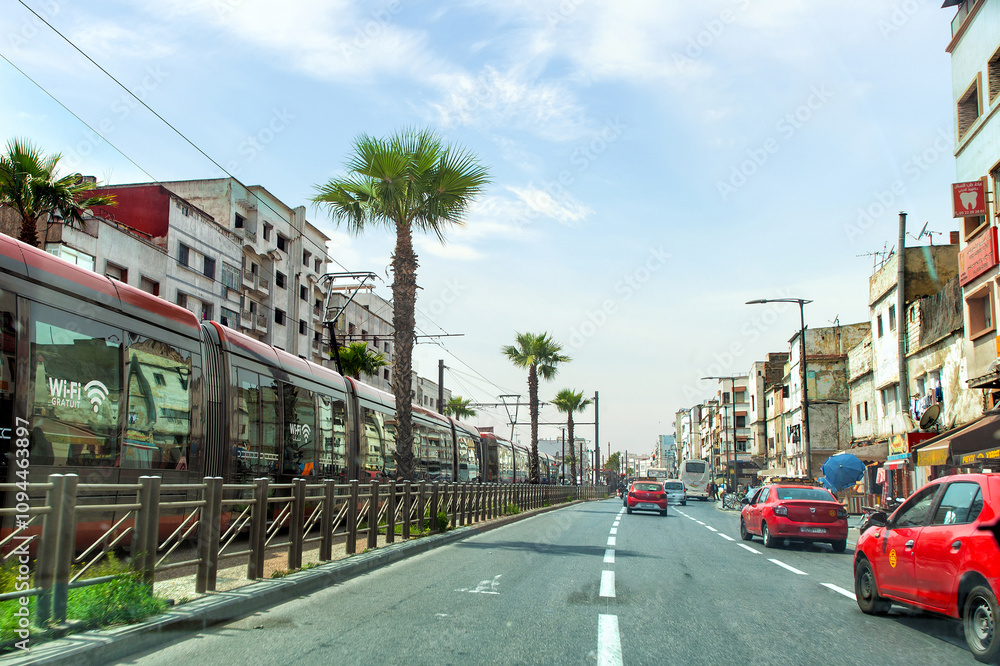 Cars and trams moving along El Fida Boulevard in downtown Casablanca ...