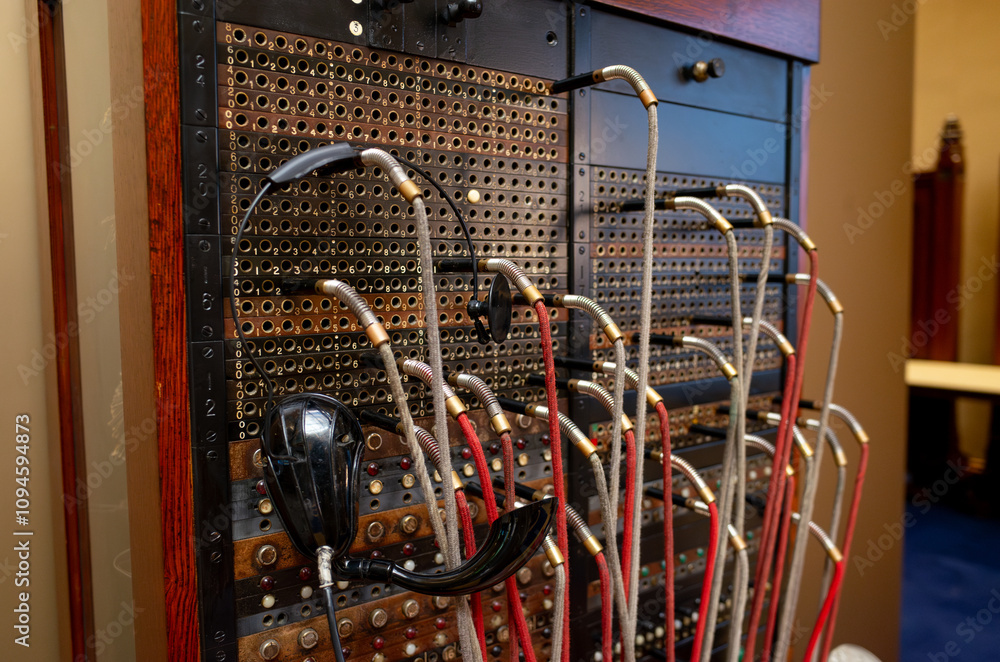 Vintage telephone switchboard panel with manual patch cables and ...
