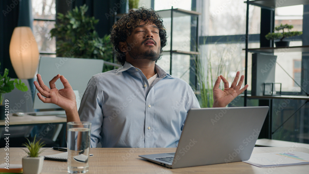 Calm Arabian latin man Indian businessman meditate at office desk zen ...