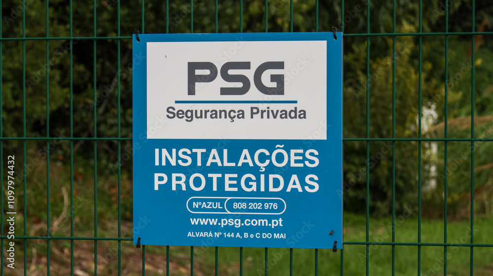 Psg seguranca privada sign on a fence protecting installations Stock ...