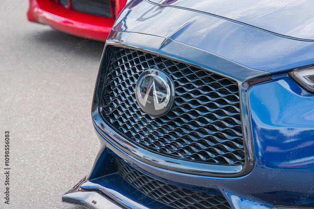 A close-up view of a predominantly blue Nissan GT-R Nismo racing cars ...