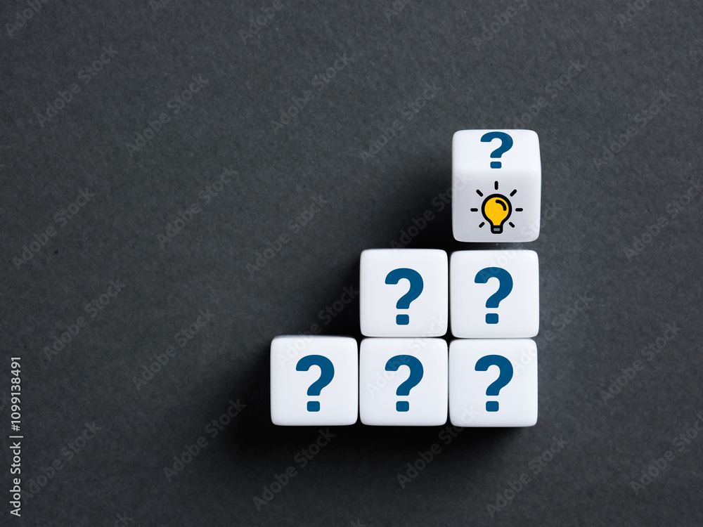 Question mark cubes forming pyramid leading to light bulb on top Stock ...