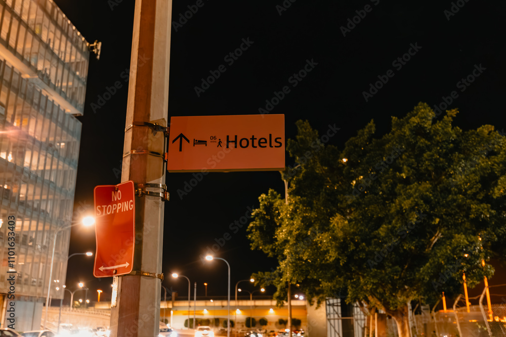Sign leading to hotels for walking traffic along footpath at the Sydney ...