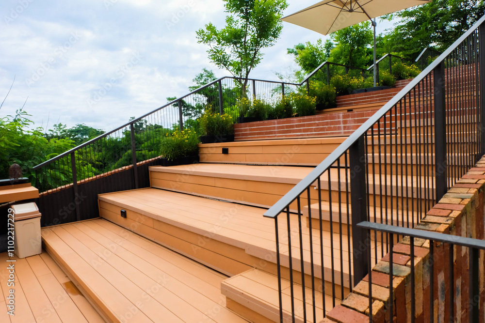 Red brick staircase in rooftopwith tree and garden,stair in school or ...