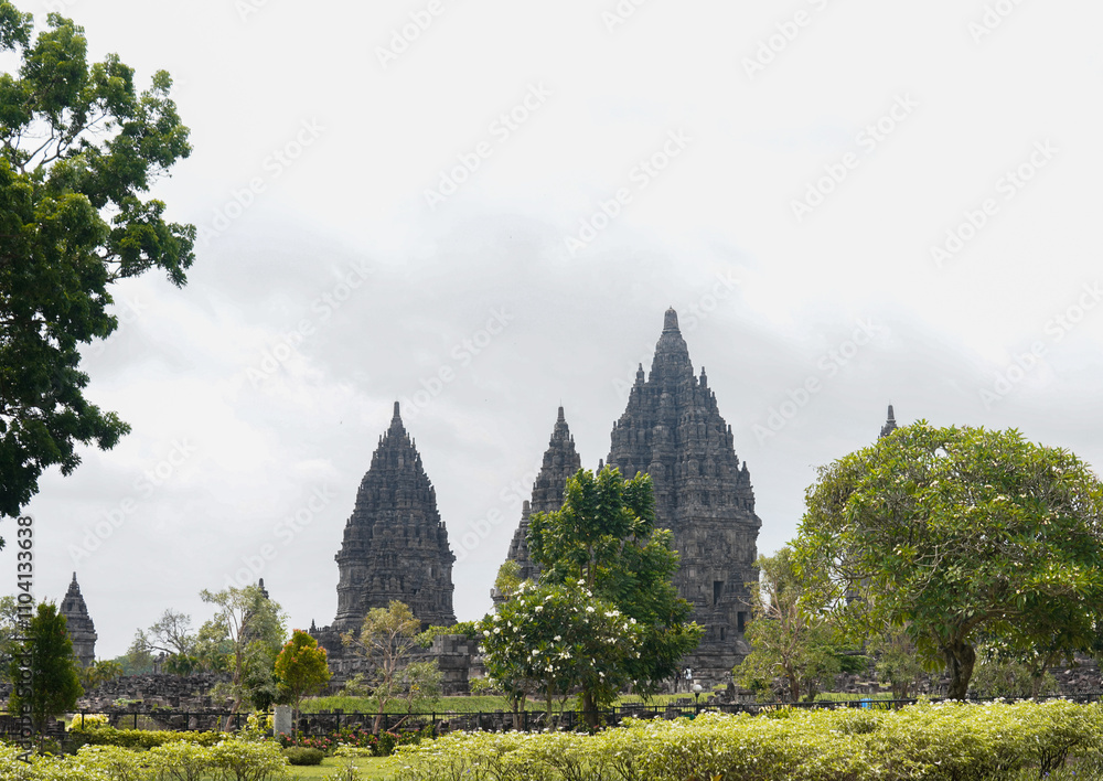 Ancient Prambanan temple complex in Indonesia, partially obscured by ...