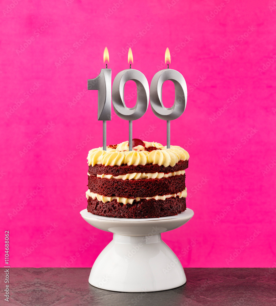 Birthday cake with number 100 candle - Red velvet on a fuchsia ...