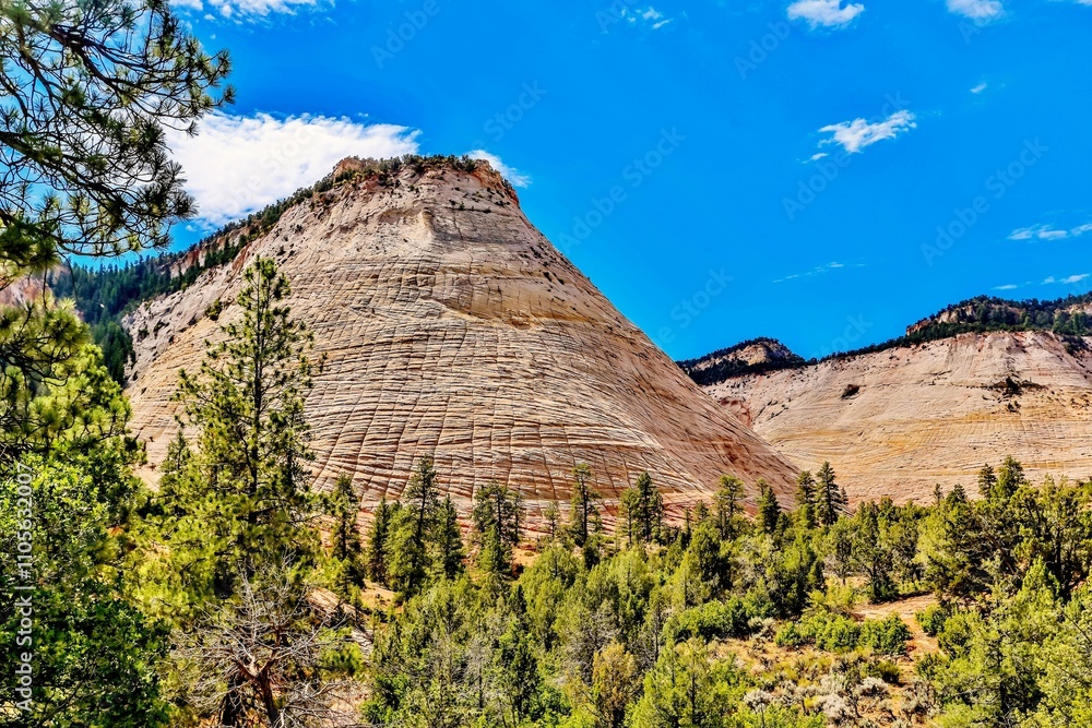 Checkerboard Mesa, a sandstone peak standing 900 feet high, in Kane ...