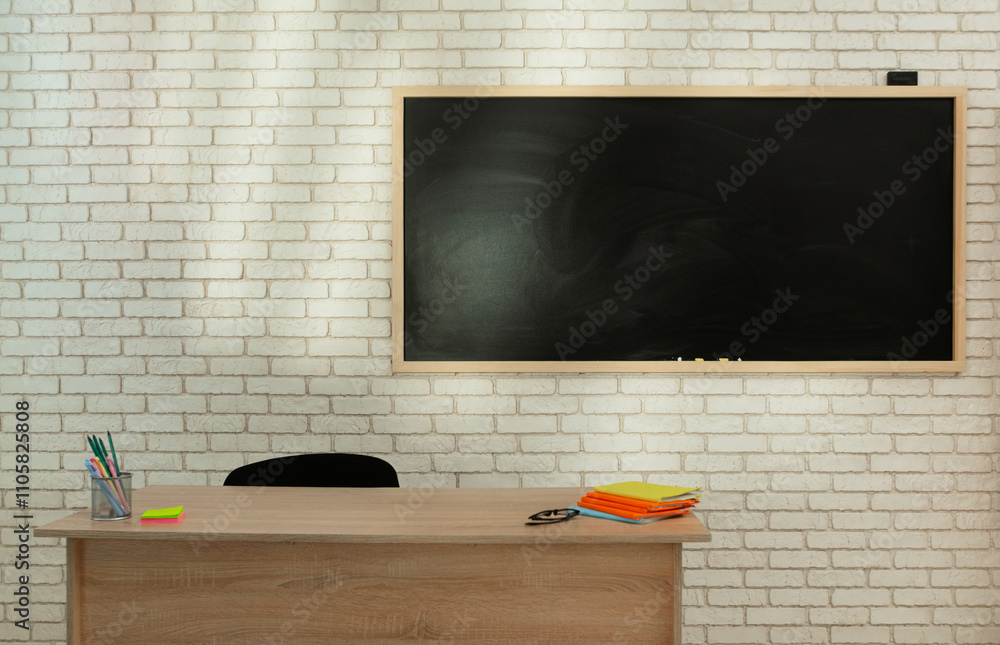 Empty modern school classroom with desks, chairs and chalkboard at ...