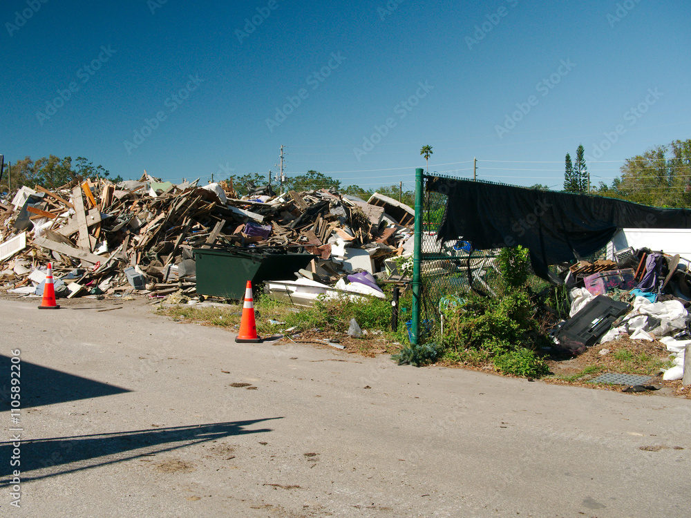 Storm Damage Debris Collection site. Entrance gate with orange cone ...