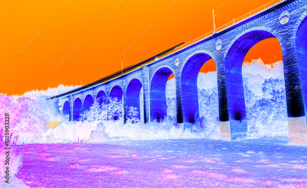 Inverted photograph of a railroad viaduct in Germany. Blue bridge with ...