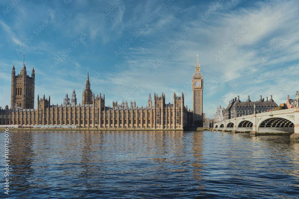 Iconic palace of westminster and big ben reflected in thames river on ...
