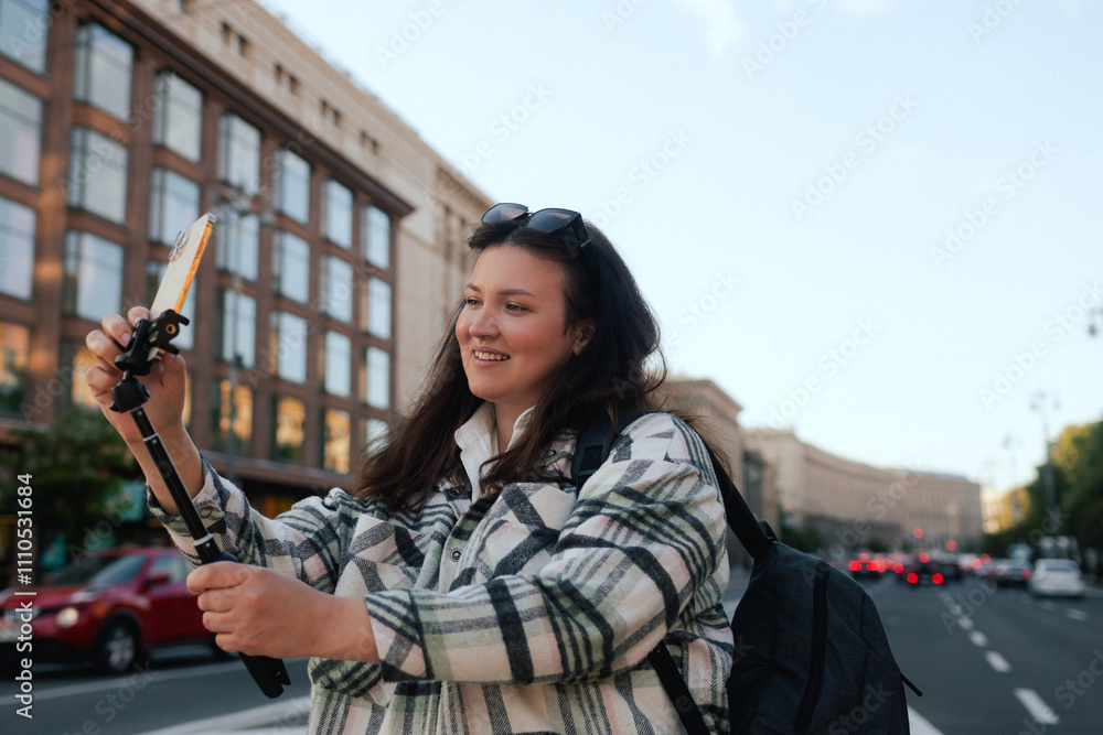 Vlogger traveler woman recording video on phone camera on Khreshchatyk ...