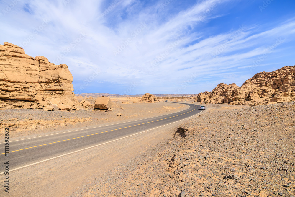 Asphalt road and yardang landform mountain natural landscape in ...