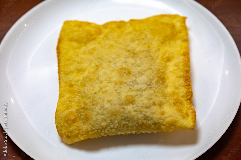 Traditional Brazilian fried pastry stuffed with ground beef. "Pastel de ...
