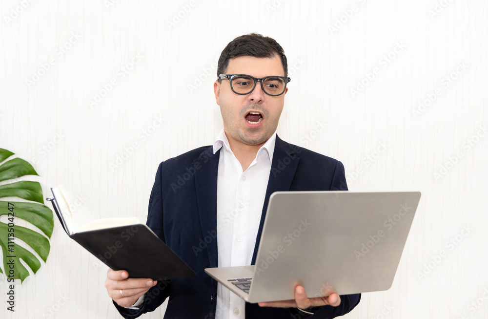 Man in a suit with glasses, throwing a crumpled paper into a small ...