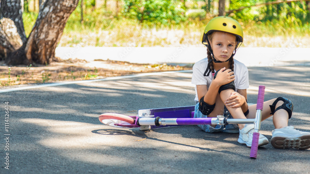Child little girl fell off her scooter at summer park. Child getting ...