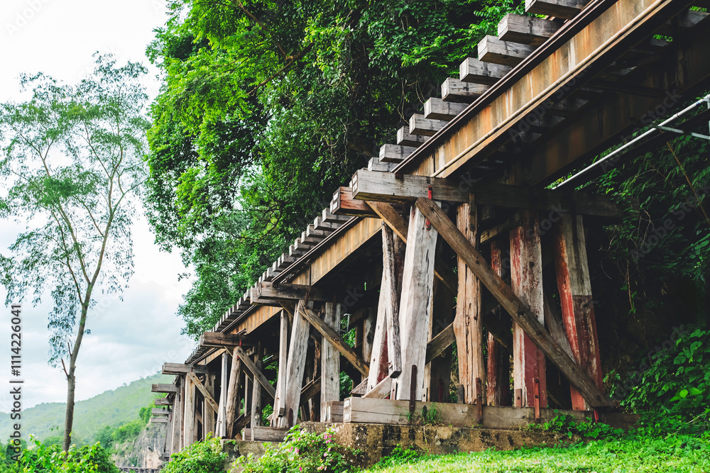 The ancient railway piers and large beams made of wood support an old ...