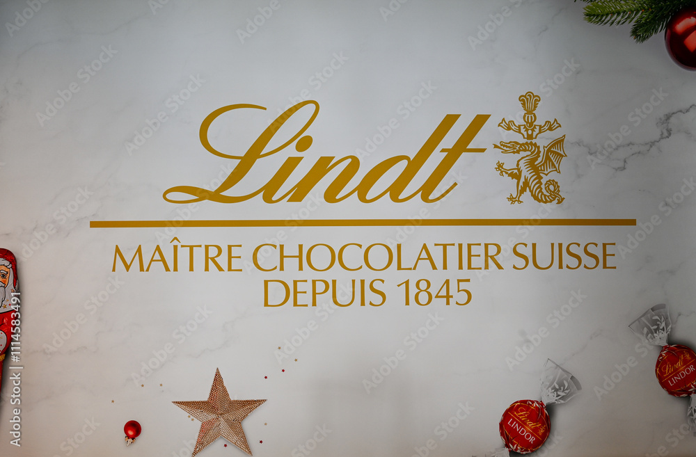 Zurich, Switzerland - 10 16 2024: The golden lettering of the chocolate ...