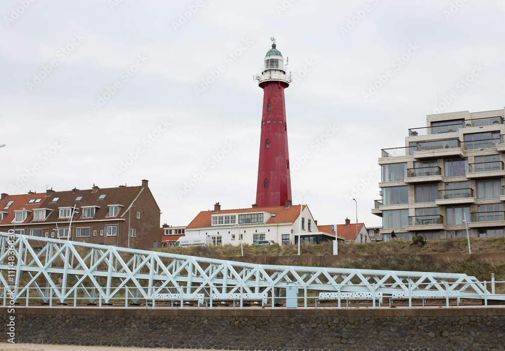 Entire and complete view of the Scheveningen red lighthouse surrounded ...