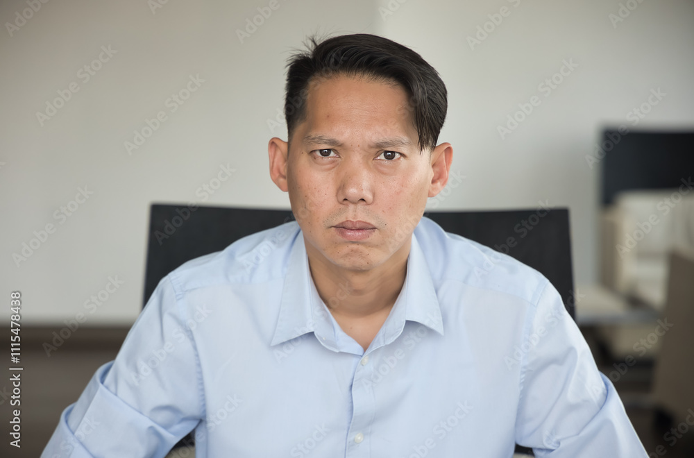 Angry upset middle aged asian office worker or business man having ...