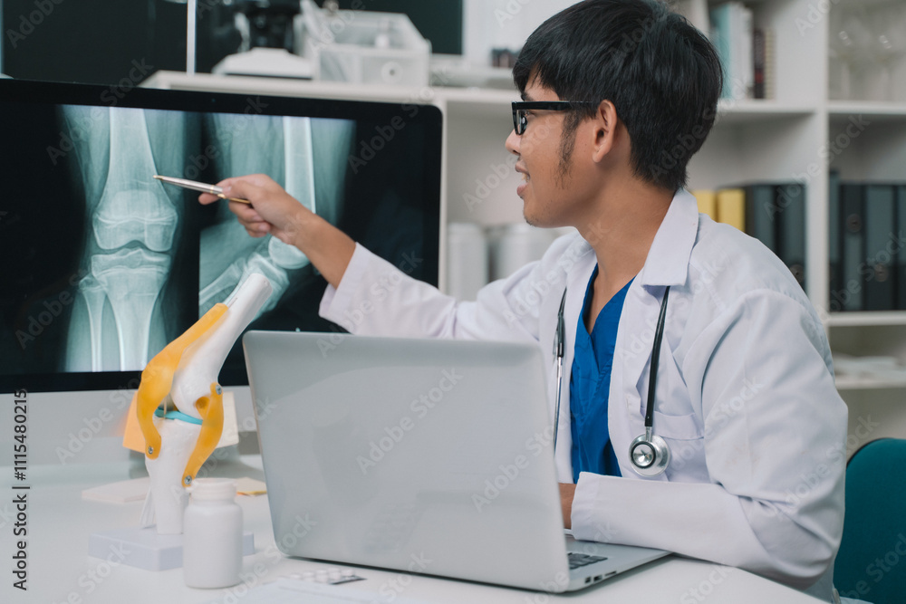 At the hospital, the doctor reviewed the x-ray of the human knee ...