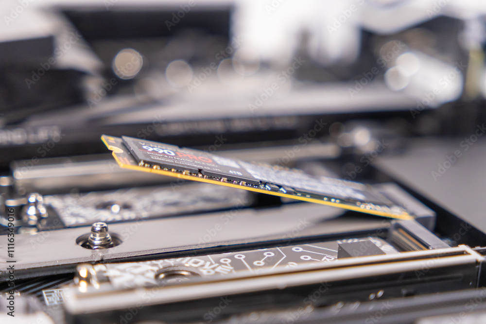 installing m.2 nvme ssd, motherboard slot, close-up, high-speed storage ...