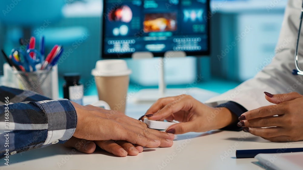 Physician measuring the oxygen saturation and pulse rate using an ...