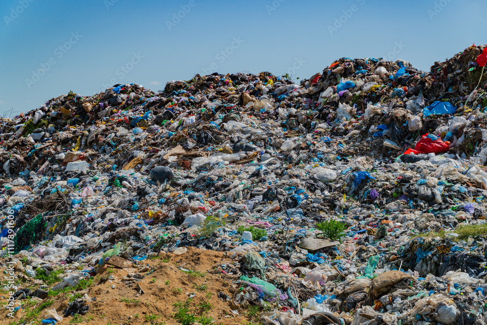 Mountains of plastic and debris fill the landscape at a landfill ...