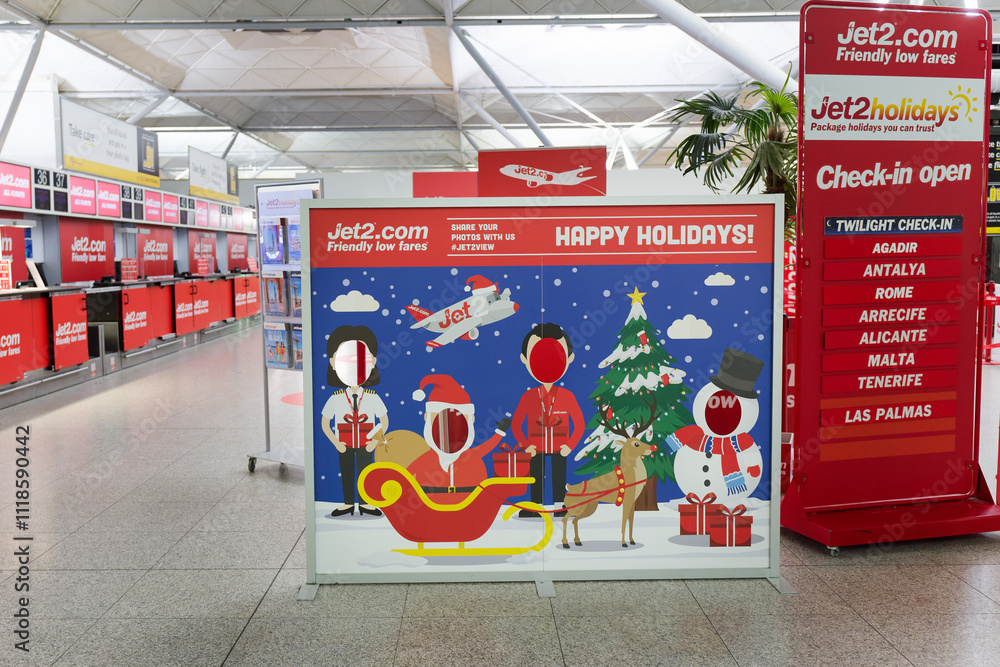 Jet2 check-in counter with holiday Christmas season photo face cutout ...