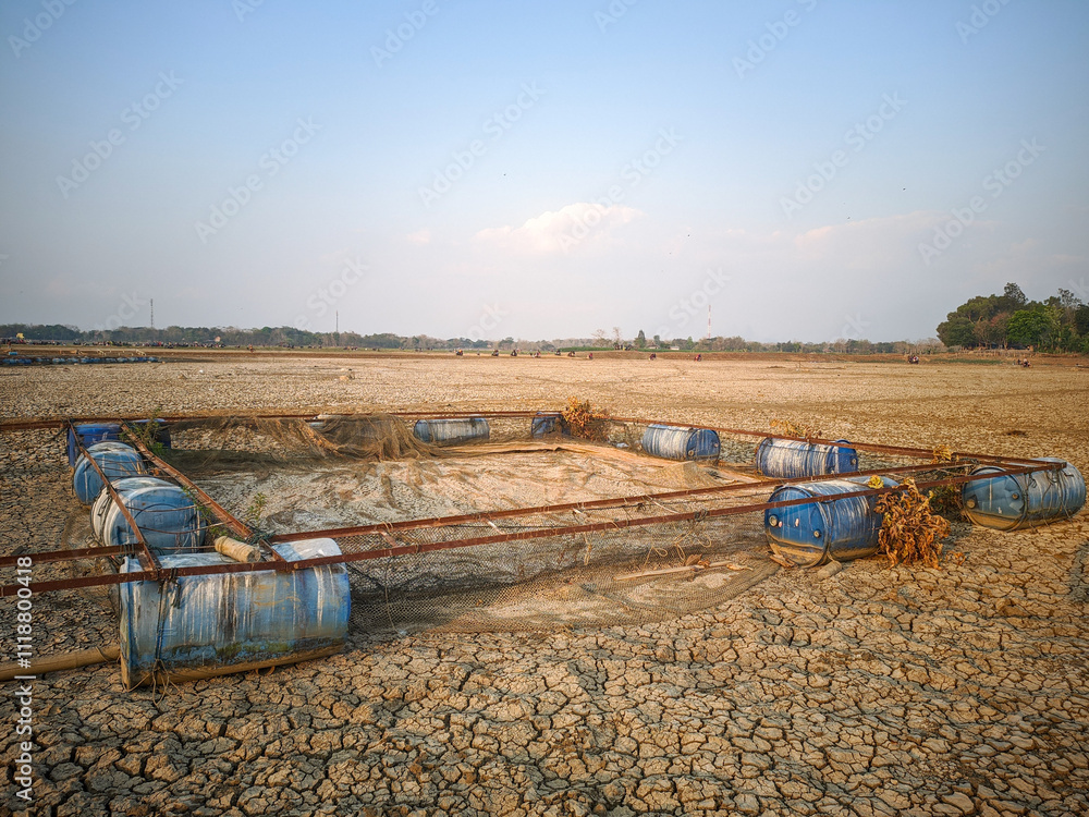 Floating fish ponds on cracked ground formed by reservoirs drying up ...