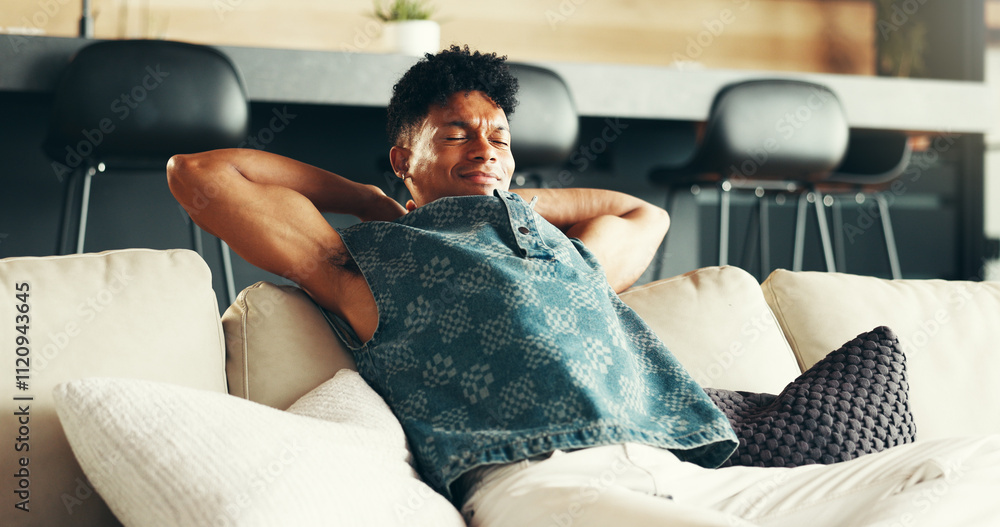 Man, tired and stretching on sofa for relax, comfort and resting on ...