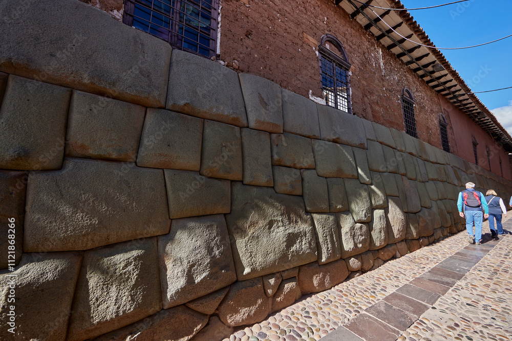 Walking through history on Hatunrumiyoc Street. Famous for the iconic ...