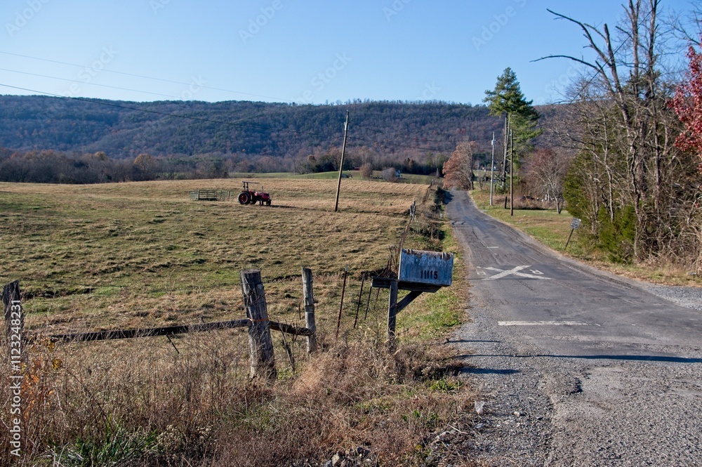 Rural route in the country with mailbox and railroad crossing lines on ...