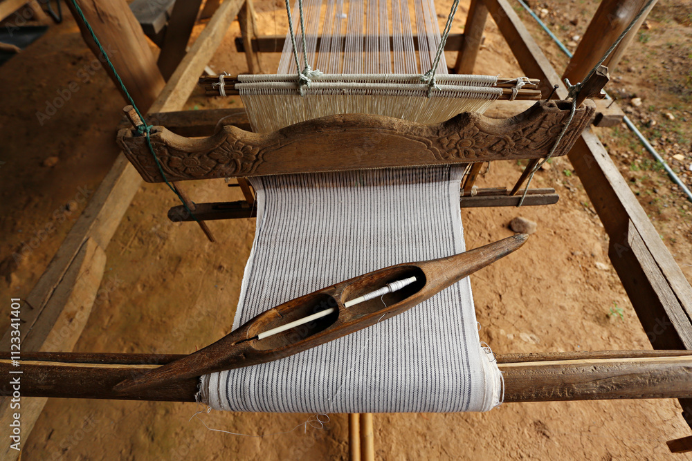 The ancient weaving loom in an interior of a wooden log hut, Important ...