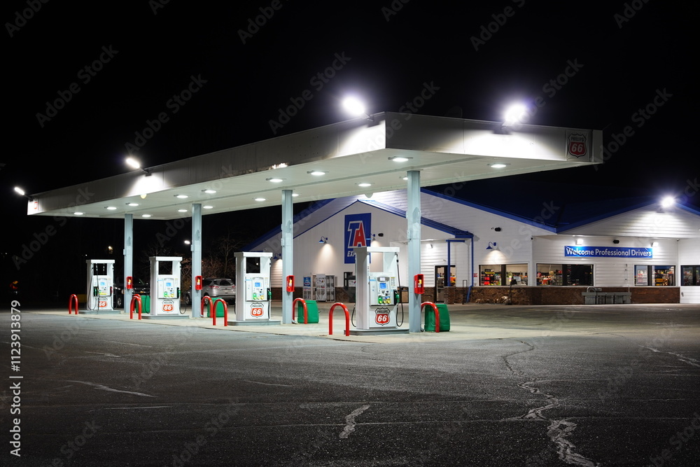 Phillips 66 fuel gas station and pumps glow at night to service drivers ...