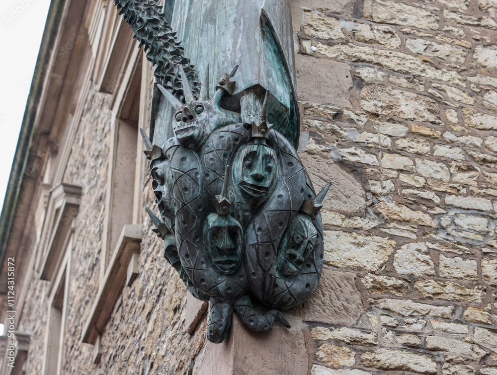 Bronze sculpture of the Archangel Michael by Josef Baron on wall of the ...