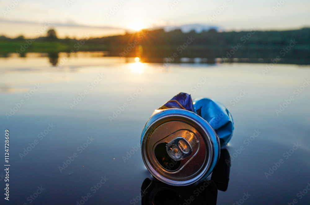 Beer can waste in lake. Empty metal soda can garbage, food waste in ...