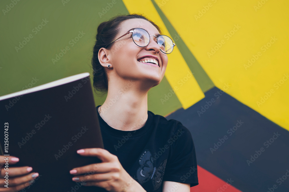 Happy smiling female student in spectacles overjoyed about successfully ...
