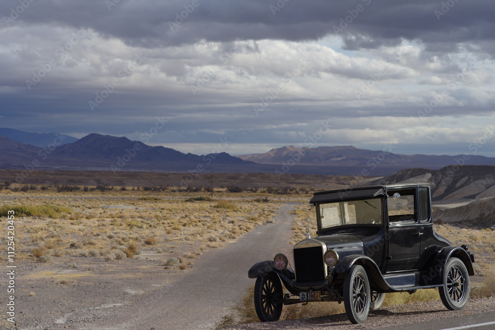 1926 Model T Ford vintage car shown parked by a roadside in the Mojave ...