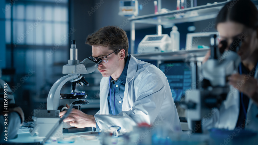 Diverse Male and Female Medical Research Scientists Work on a New ...