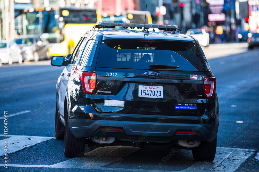Rear view of an LAPD patrol SUV on a busy Los Angeles street, featuring ...