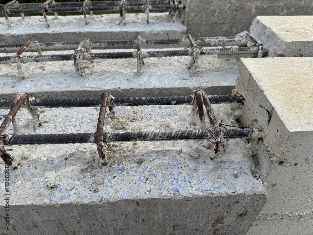 Reinforced Concrete Beams: Close-up detail of steel rebar embedded in ...