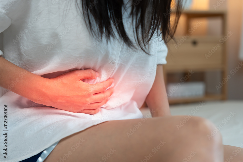 stomach ache. Asian women have abdominal pain, indigestion, gastritis, menstrual cramps ...