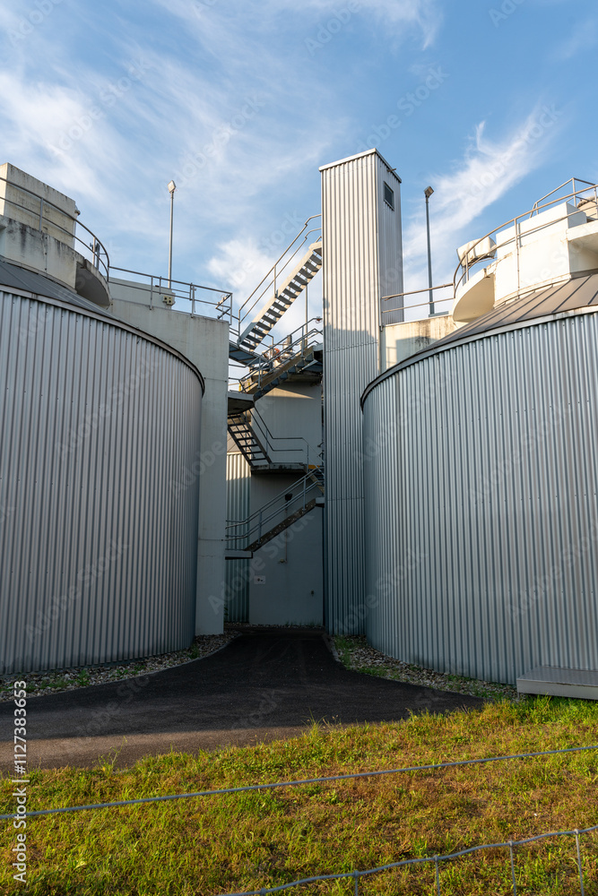 Natural, biogas storage under a blue and lightly clouded sky. Biogas ...