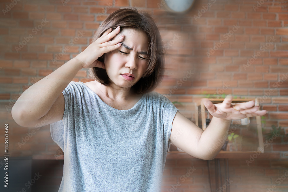 Asian woman experiencing sudden dizziness, headache, and loss of ...