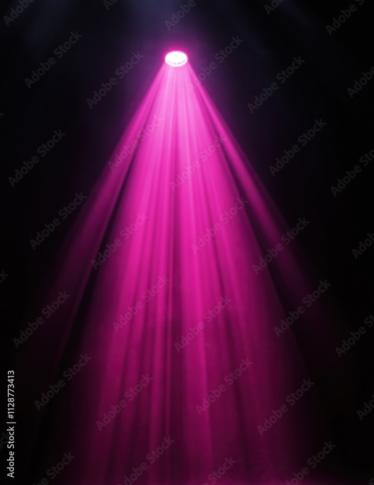 Bright stage spotlight shines on smoky mist. Fog enhances ethereal ...
