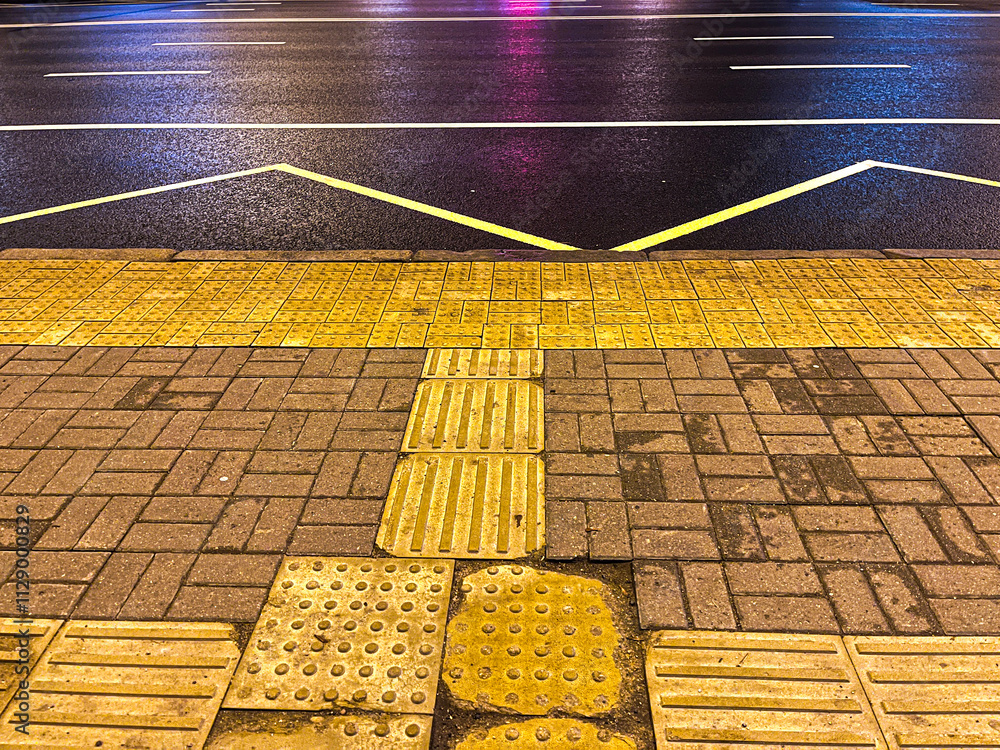 Bus Stop at Night with Road Markings and Tactile Paving wet Asphalt ...