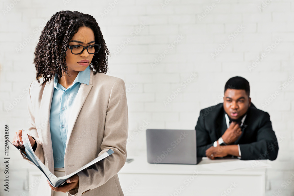 Sexual intimidation concept. Perverted black businessman looking at his ...