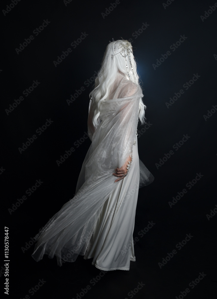 full length portrait of beautiful blonde female model wearing white ...